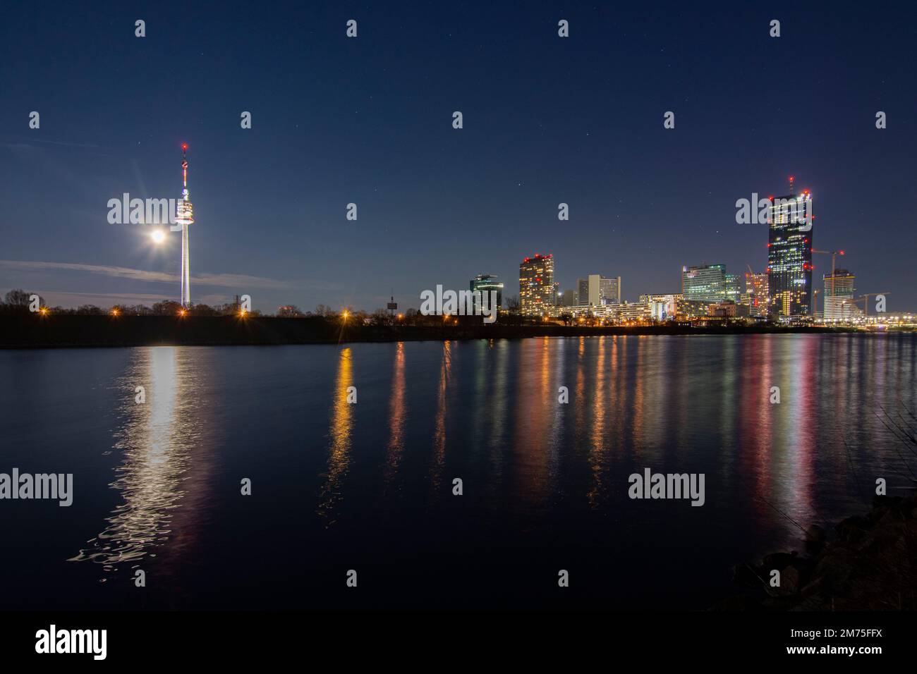 Wien, Vienna: full moon at river Neue Donau (New Danube), tower ...