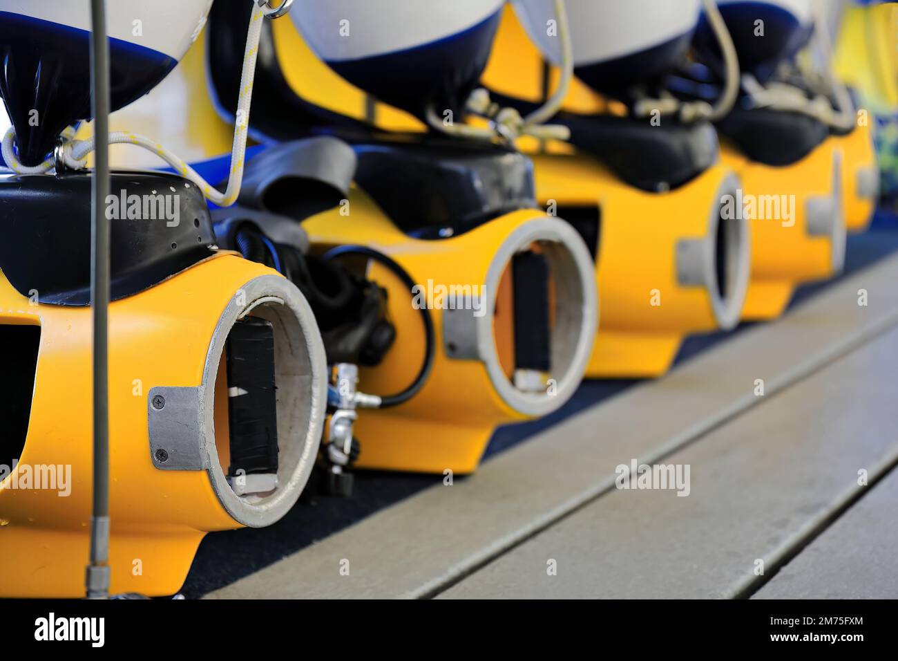 388 Row of yellow diving scooters on a tourist pontoon. Great Barrier ...