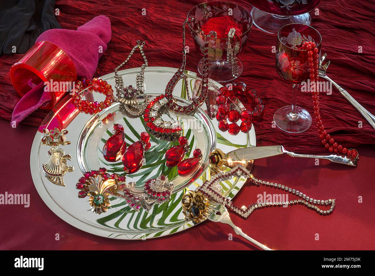 Rhinestone jewellery and accessories decorated on a silver plate and ...