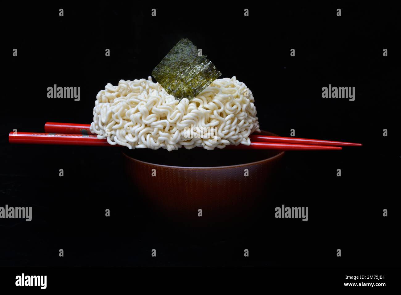 Nori, dried paper-like sheet of seaweed and Asian noodles on a shell ...
