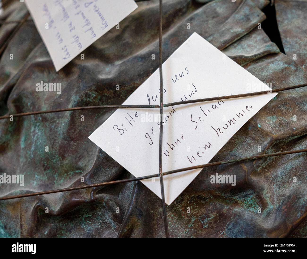 Supplication behind the grille on a statue in the Protestant Parish ...