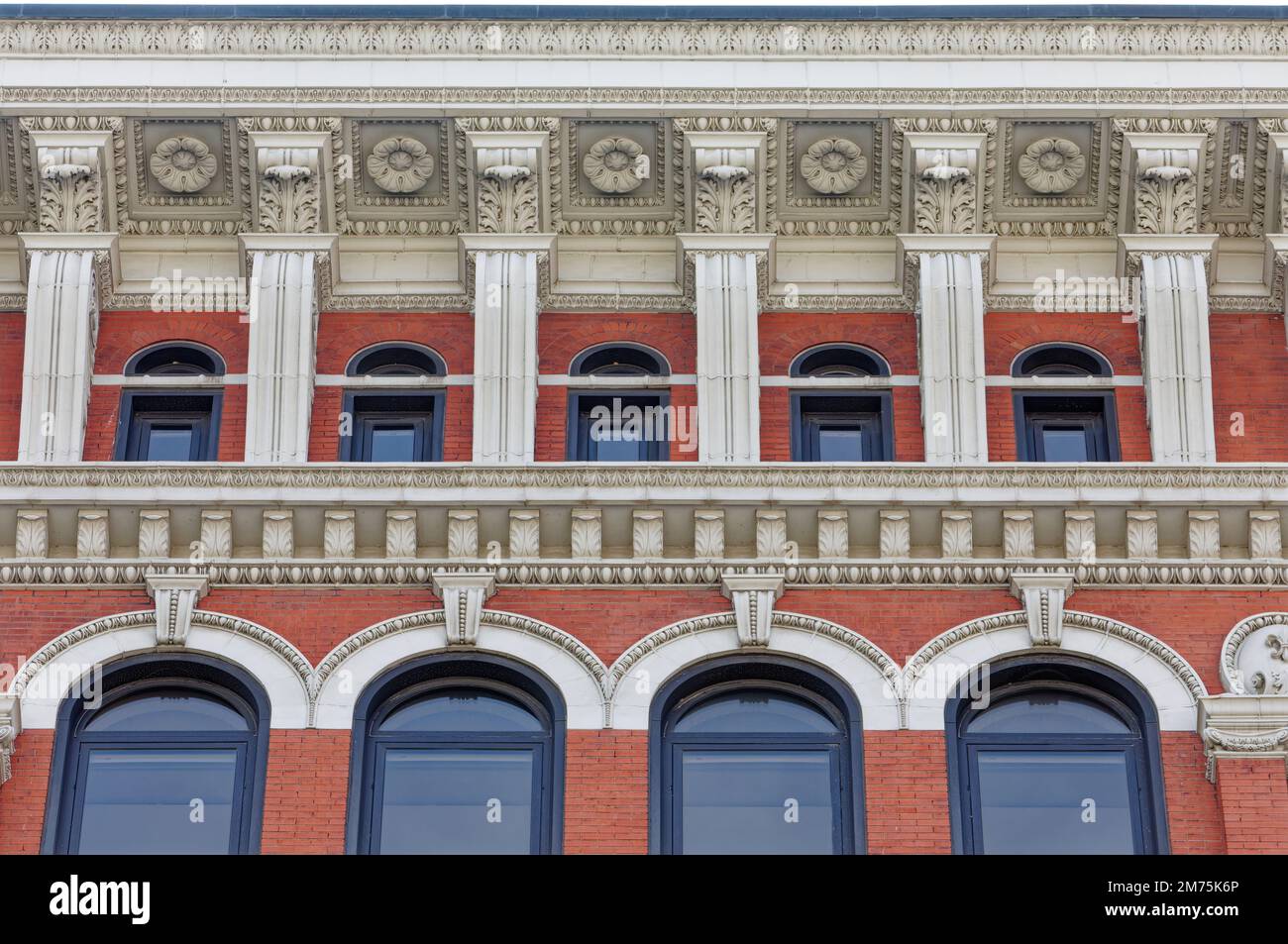 44 massive terra cotta brackets frame the top story windows and support ...