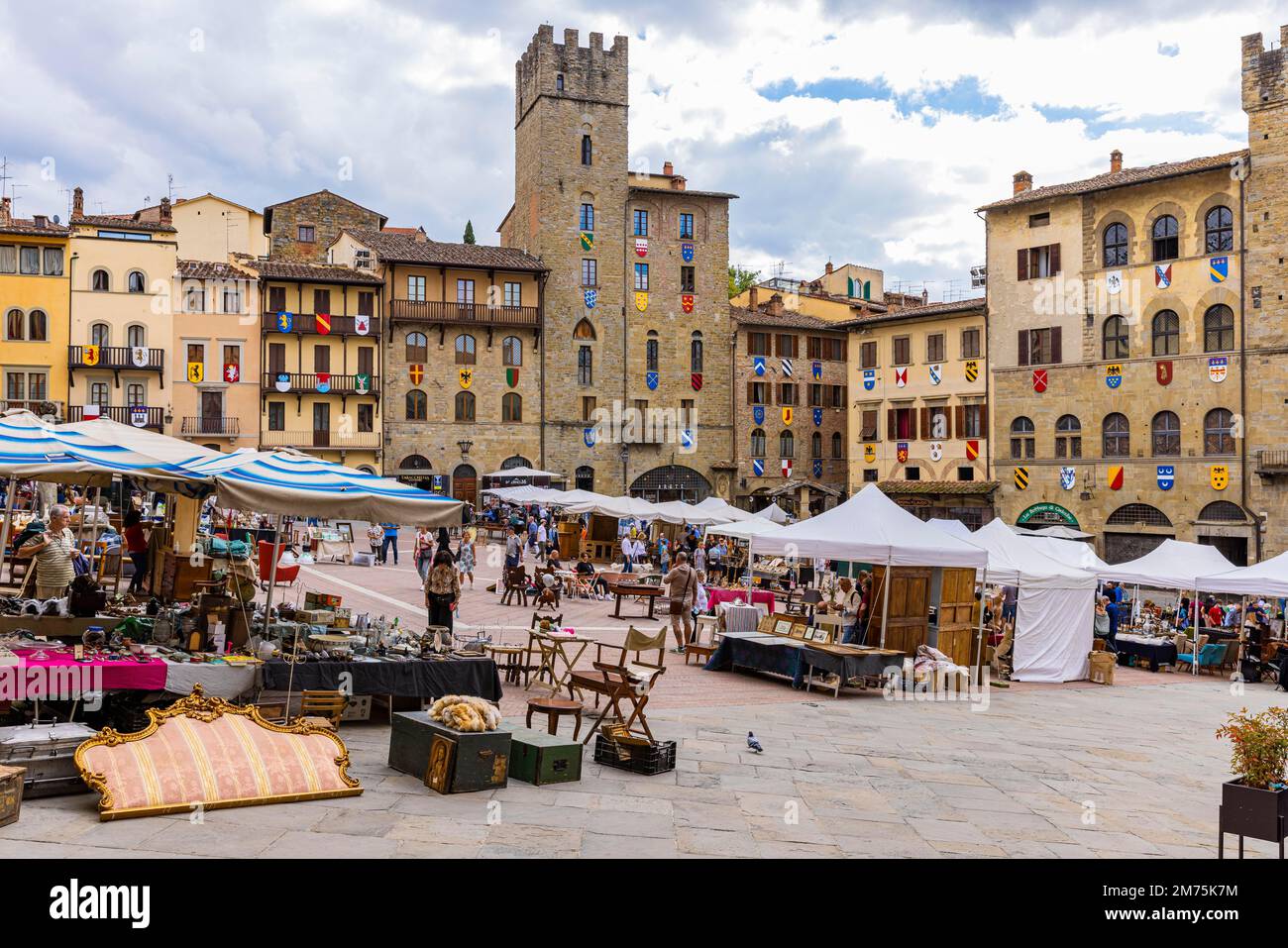 Stalls at the antique market in the old town of Arezzo, Piazza Grande ...