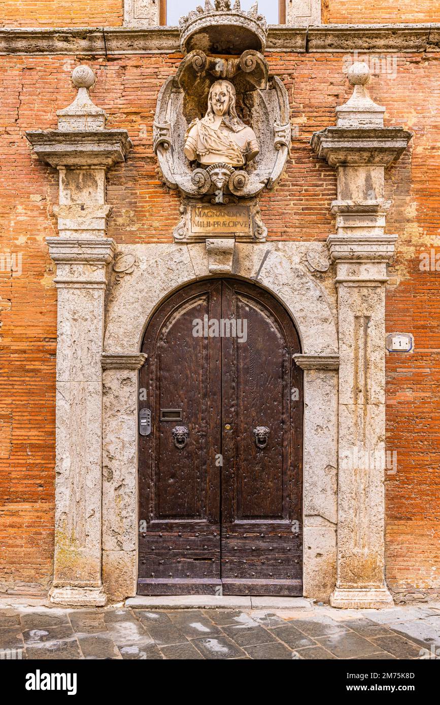 Historic round arched house entrance gate of a palace, framed with ...