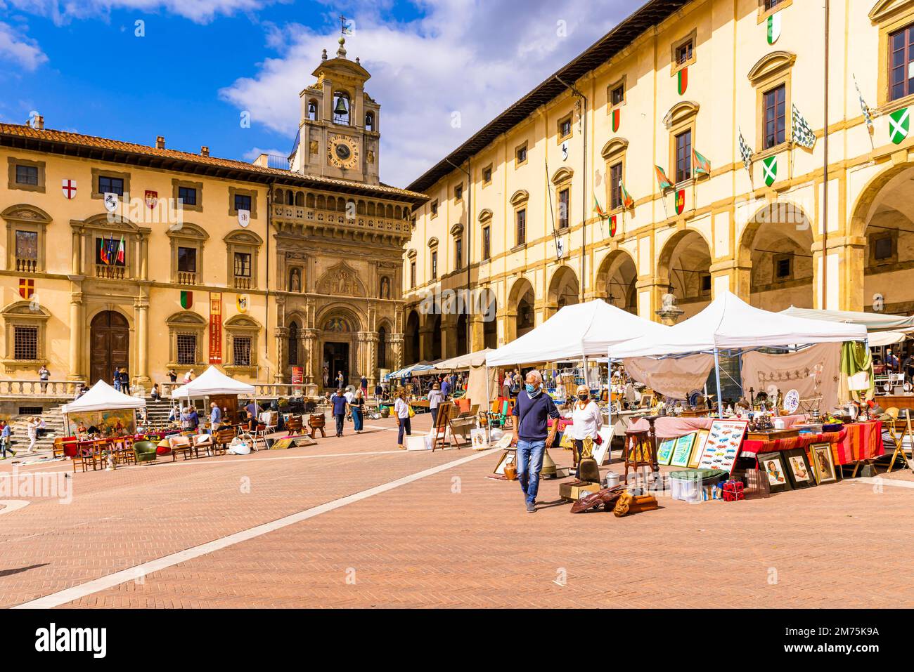 Stalls at the antique market in the old town of Arezzo, Piazza Grande ...