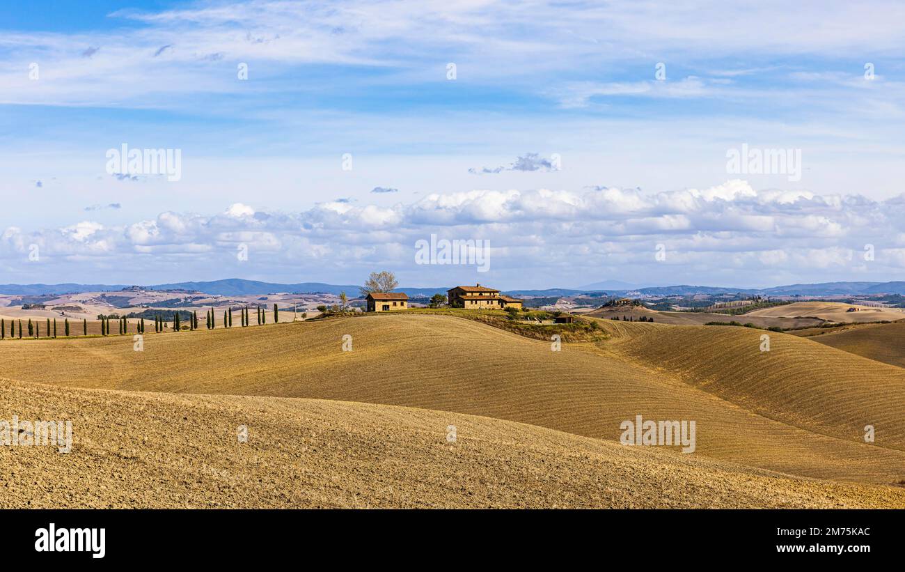 Country house in hilly landscape, ploughed fields, near Ville di ...