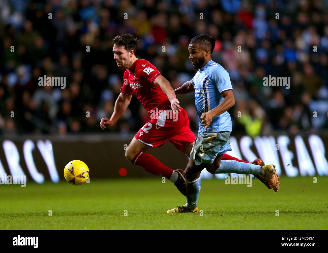 Wrexham's Thomas O'Connor (left) and Coventry City's Kasey Palmer ...