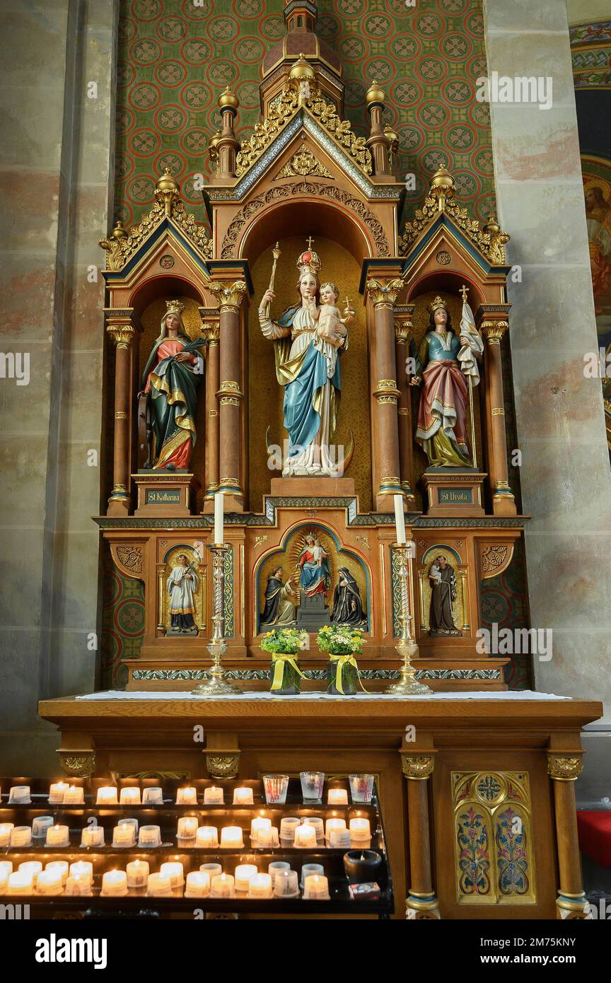 Side altar with sacrificial candles, Catholic Parish Church, Maria ...