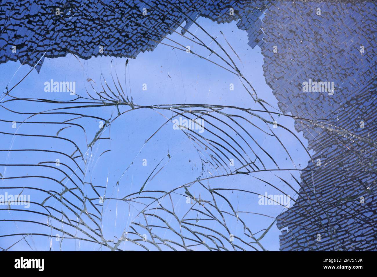 Shattered and broken glass pane with fractures, cracks and shapes Stock ...