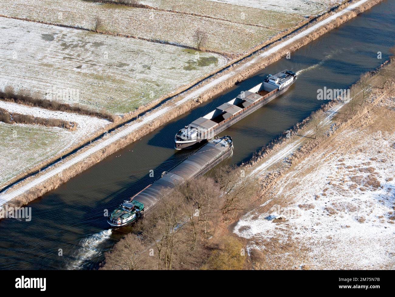Aerial view of two barges in the Elbe Luebeck Canal in winter, canal ...