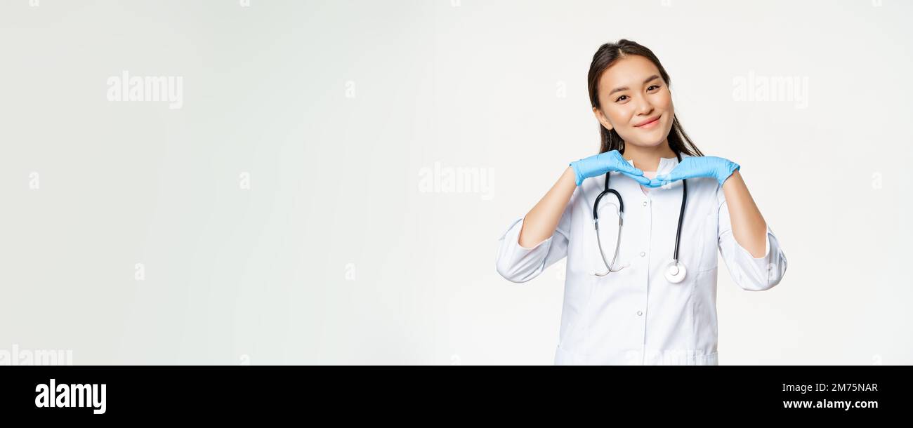 Image of smiling asian doctor, dermatologist shows healthy skin and ...