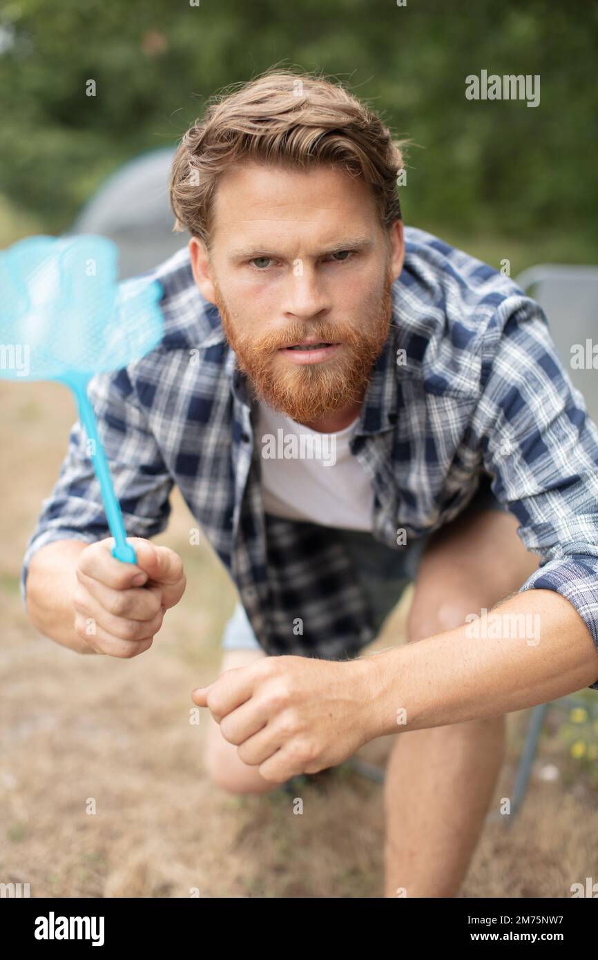 Man fly swatter hi-res stock photography and images - Alamy