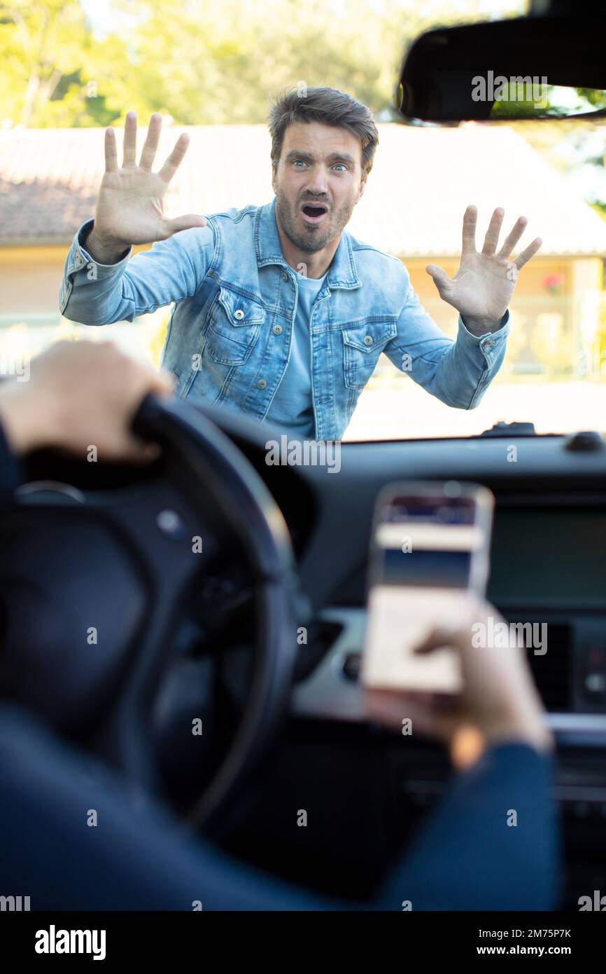 a driver using his phone runs over a pedestrian Stock Photo - Alamy