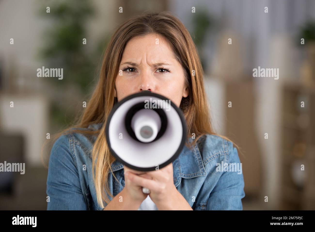 pretty woman with a megaphone Stock Photo - Alamy