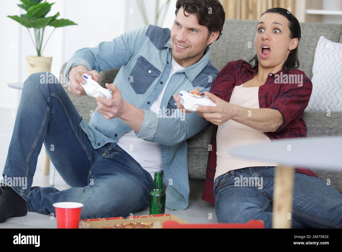 couple playing video game together Stock Photo - Alamy