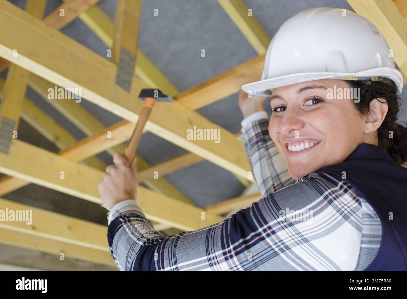 female worker processing wooden beam Stock Photo - Alamy