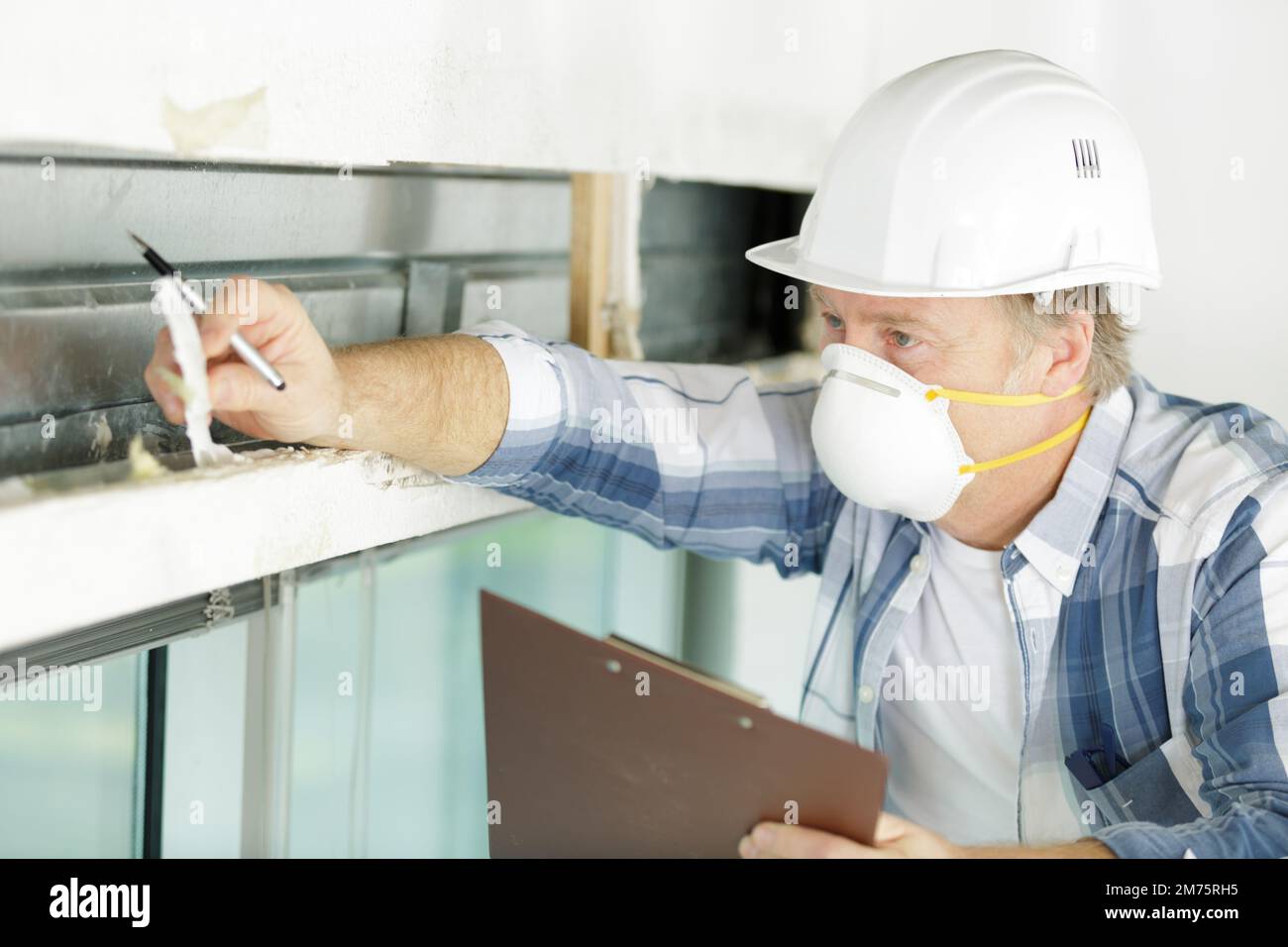 Inspecting a property hi-res stock photography and images - Alamy