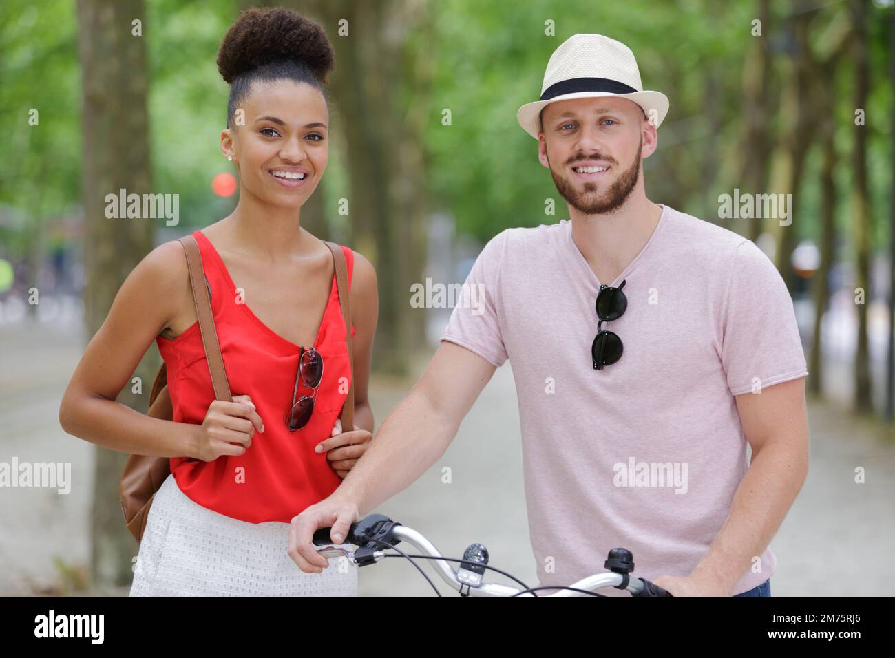 Male friends walking park spring hi-res stock photography and images - Alamy