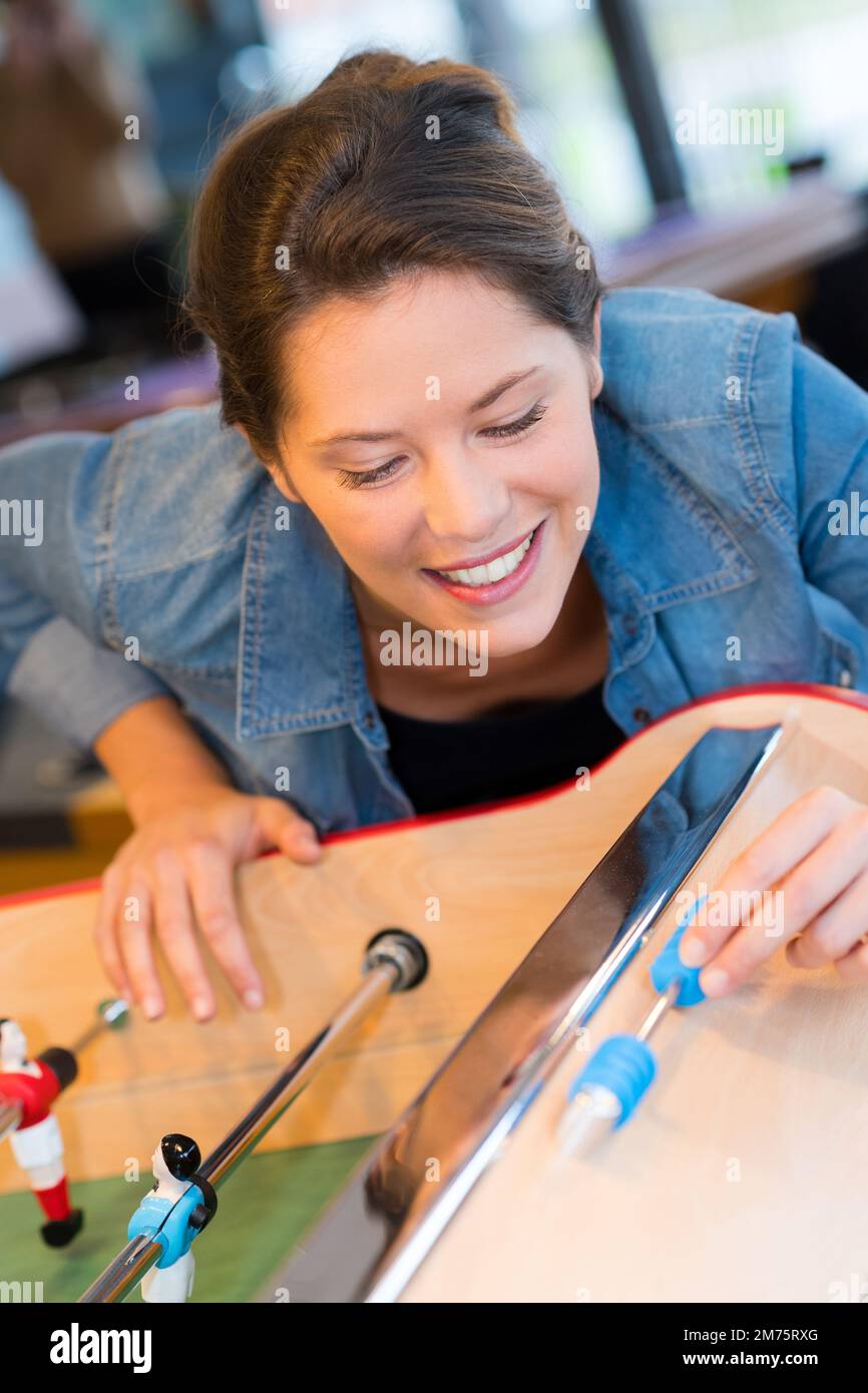 female having fun while playing table football Stock Photo - Alamy