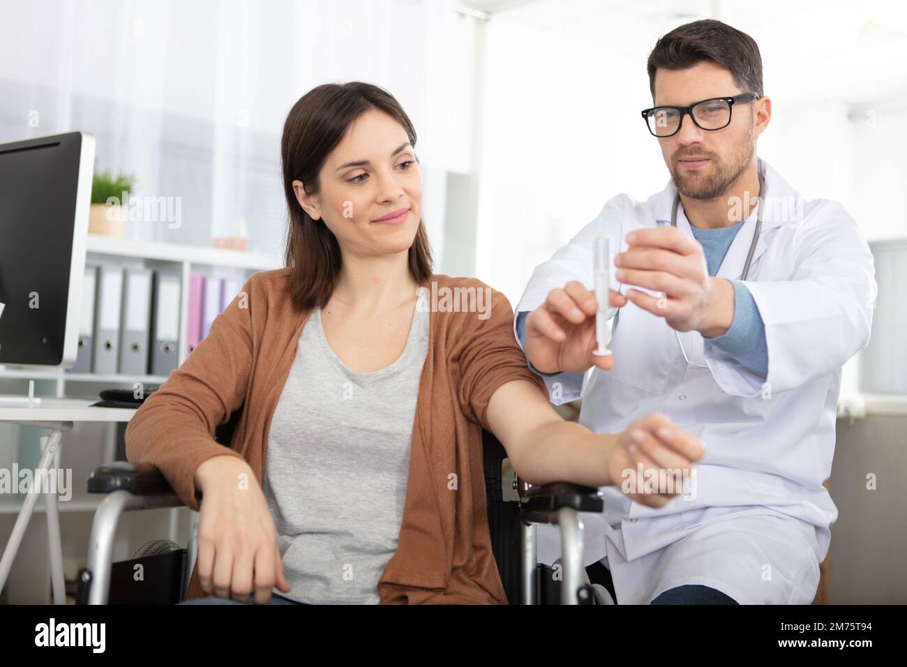 Friendly doctor working giving hi-res stock photography and images - Alamy