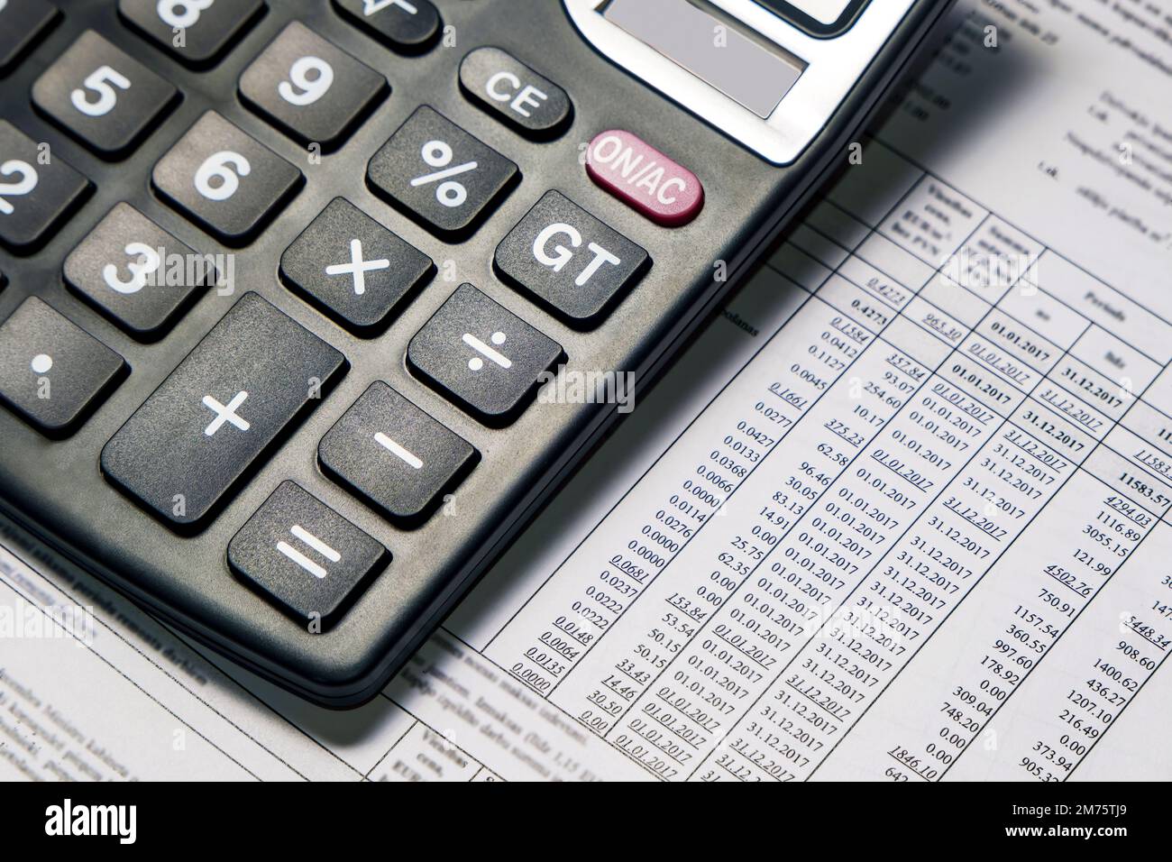 Utility bill and calculator on the table. Analysis of financial data ...