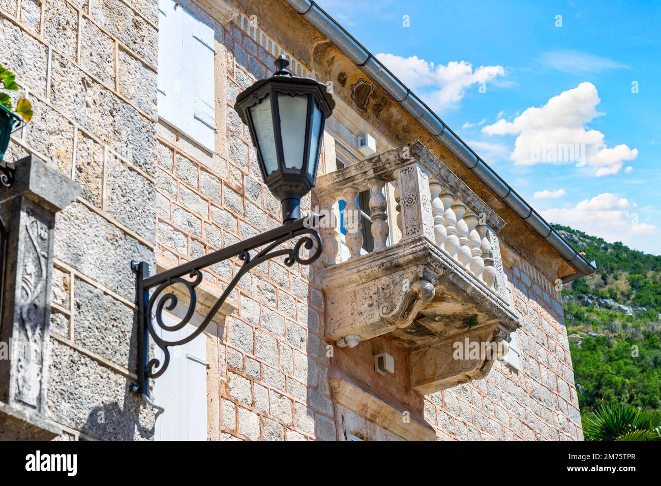 Retro lantern near balcony on old house in Perast, Montenegro Stock ...