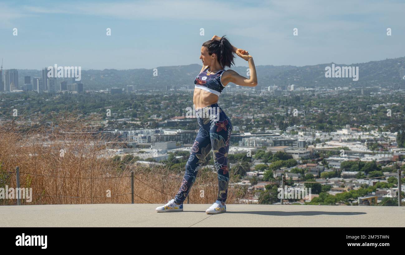 Fitness model admiring Los Angeles landscape Stock Photo - Alamy