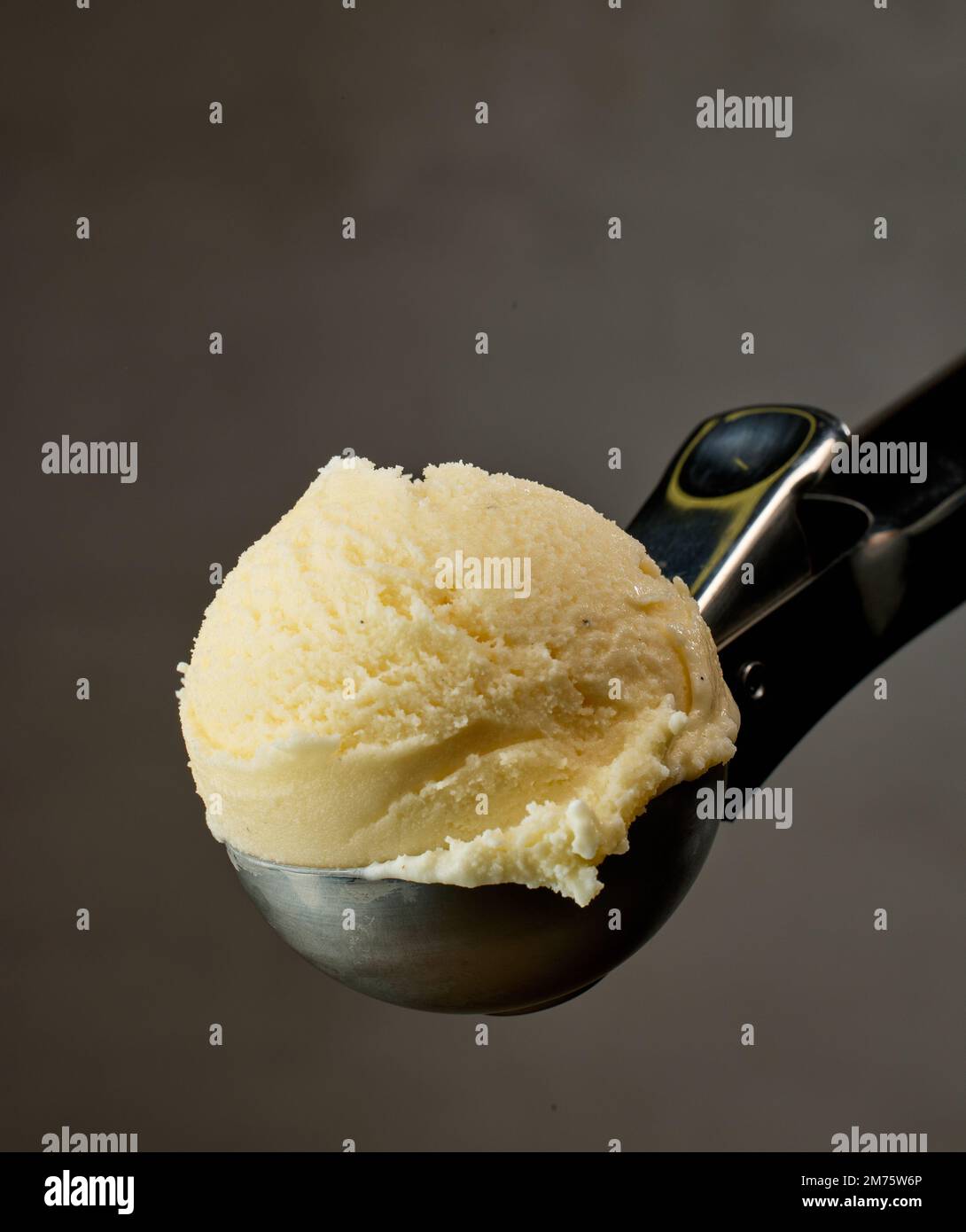 vanilla ice cream ball on dark grey background Stock Photo - Alamy