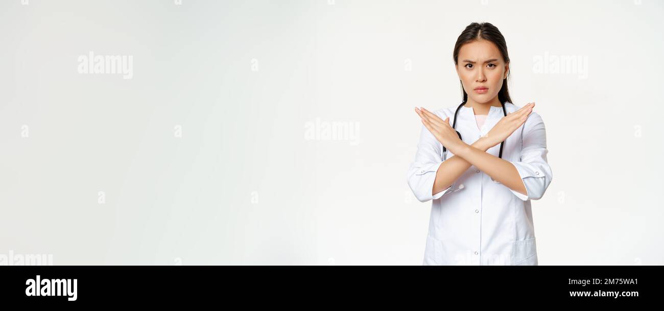 Serious asian woman doctor prohibit patient behaviour, showing stop ...