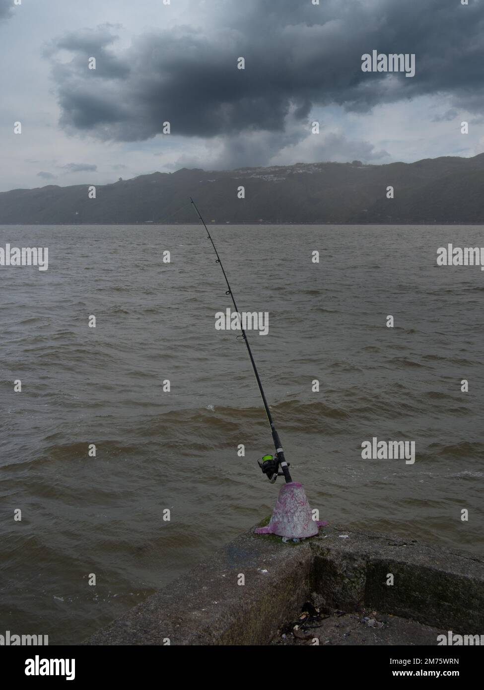 Fishing Off The Wharf Stock Photo - Alamy