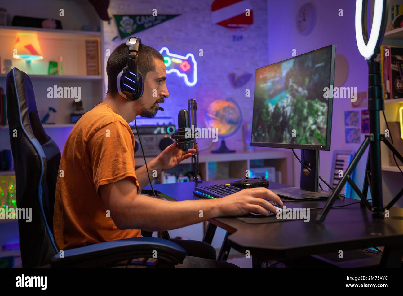 Professional Gamer Streaming and Playing Online Video Game on Computer ...