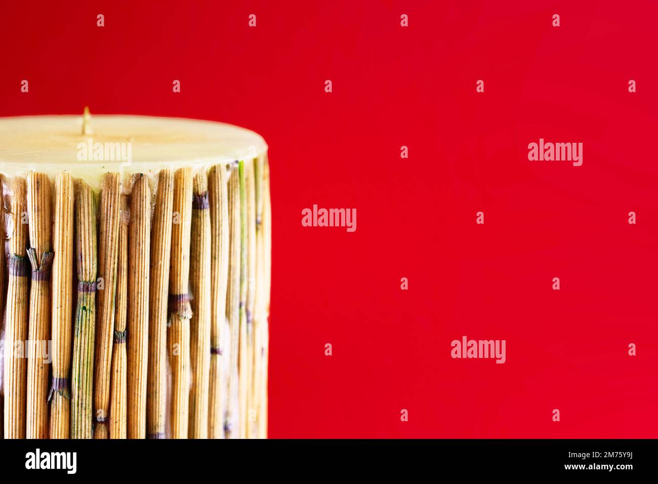 bamboo candle for peace and calm zen mood red background Stock Photo ...