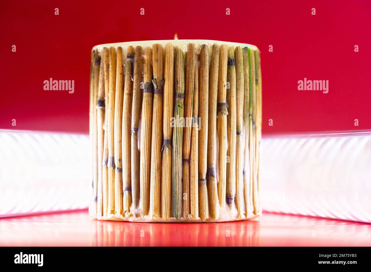 bamboo candle for peace and calm zen mood red background Stock Photo ...