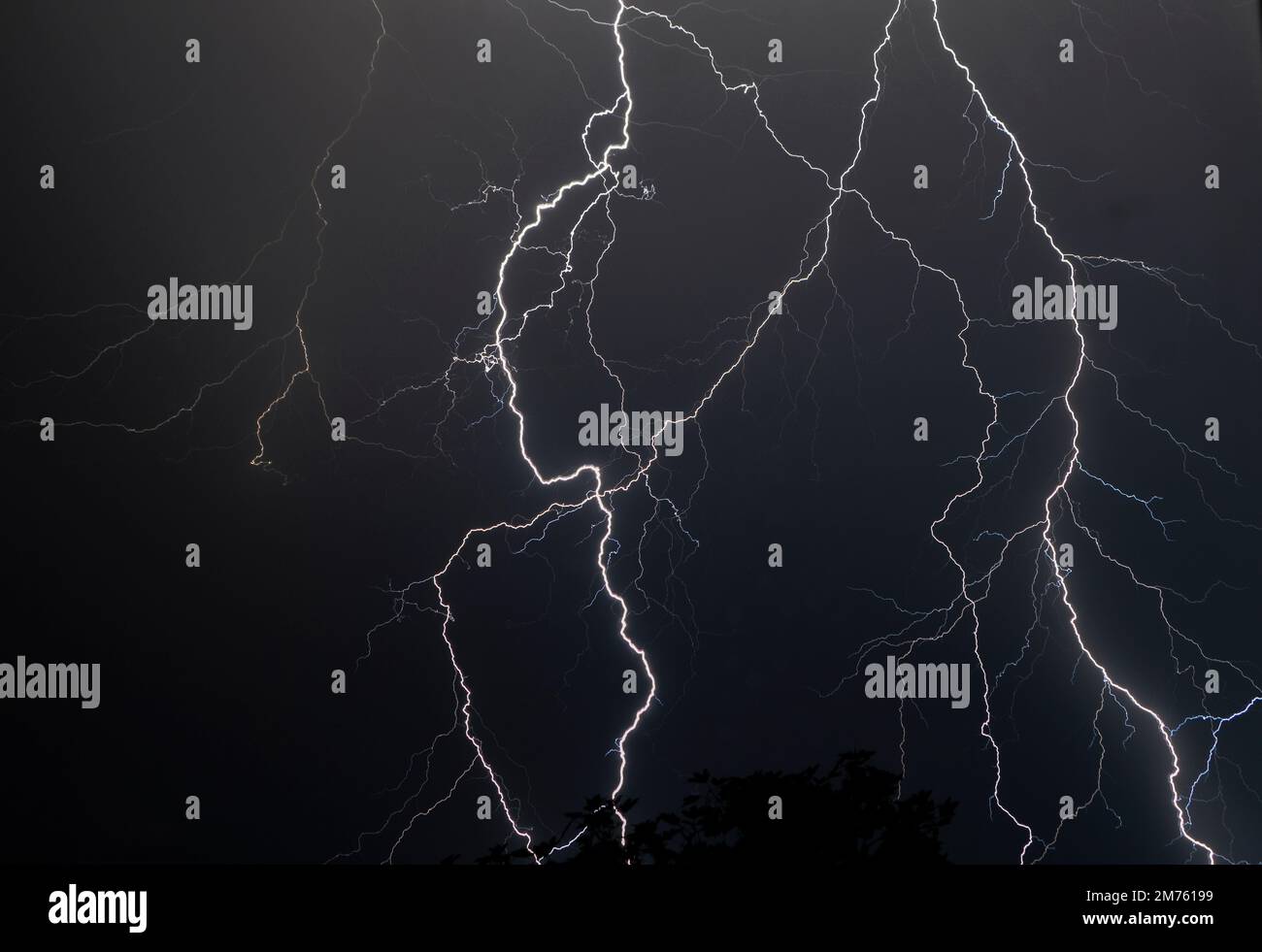 The fork lightning striking down Stock Photo - Alamy