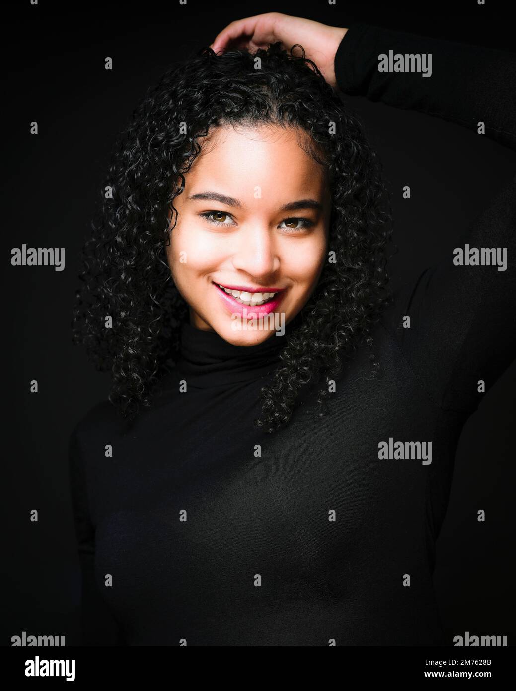 Multiracial woman smiling hi-res stock photography and images - Alamy