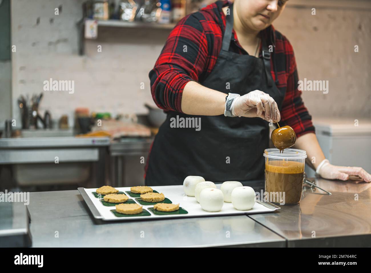 Making delicious sweets. Professional bakery chef creating new dessert ...