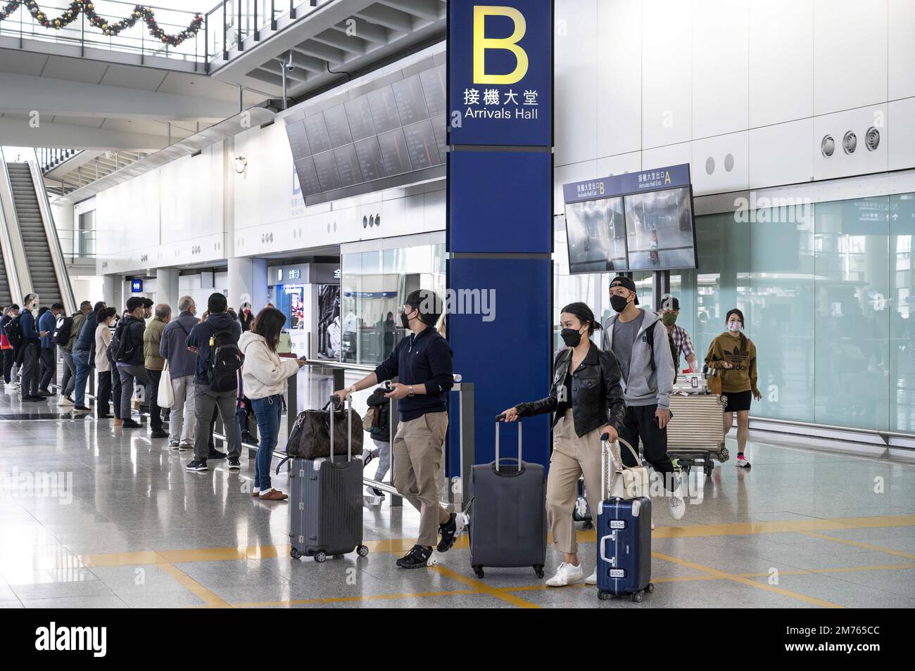 Hong Kong, China. 29th Dec, 2022. Passengers exit the arrival hall at ...