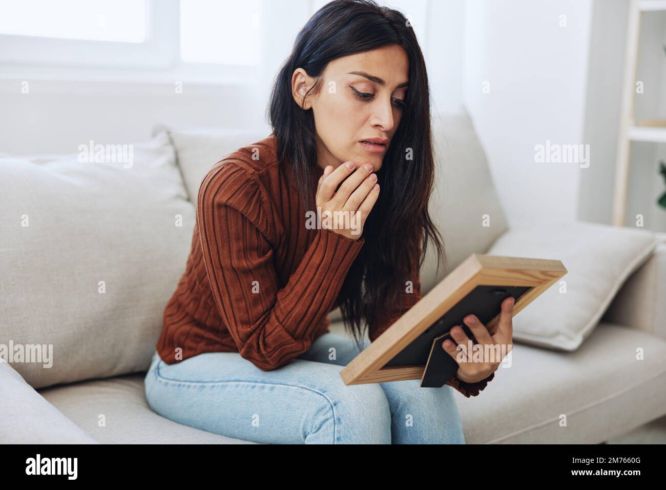 Woman sad photo frame hi-res stock photography and images - Alamy