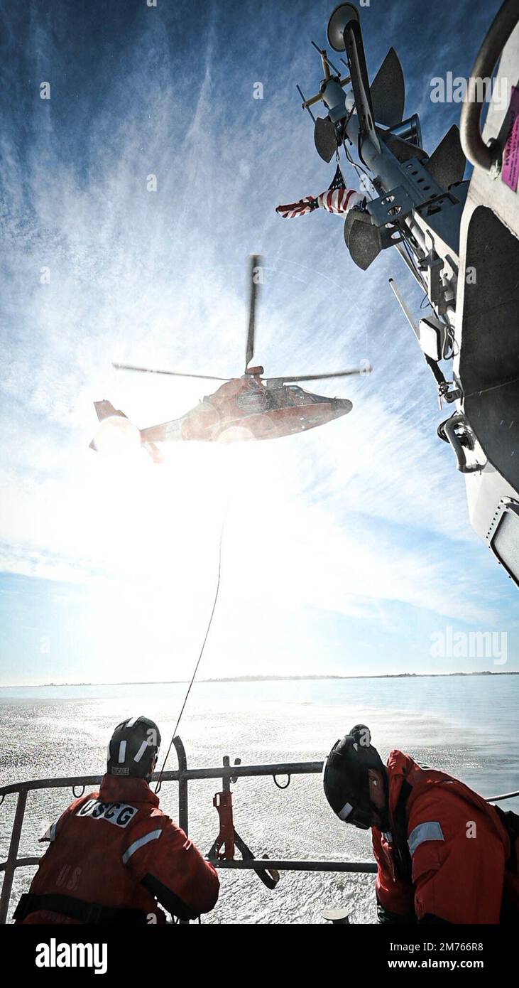 A U.S. Coast Guard Eurocopter MH-65 Dolphin Helicopter crew from Air ...
