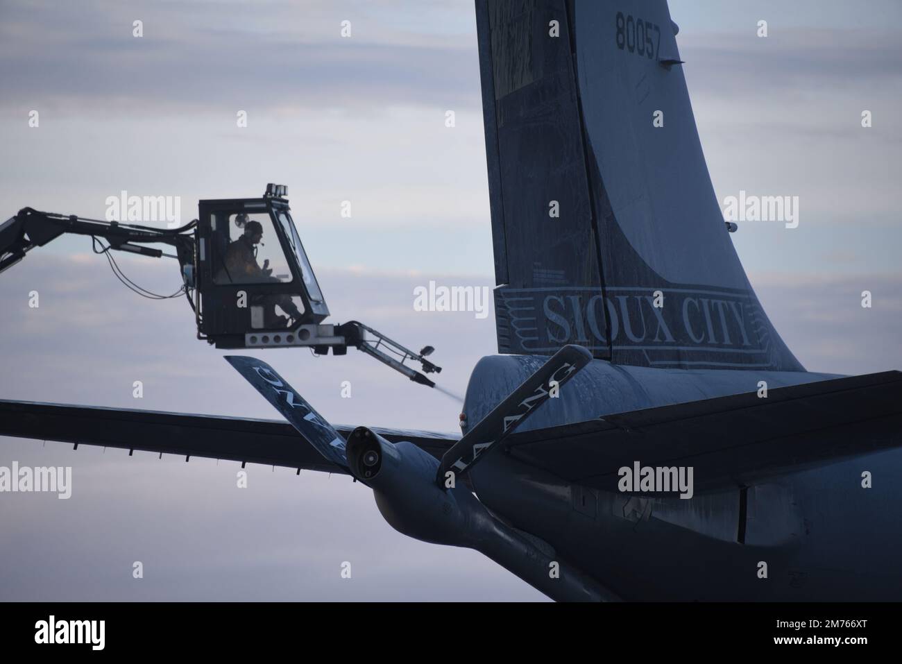 A crew chief from the Iowa Air National Guard deices a frosty U.S. Air ...