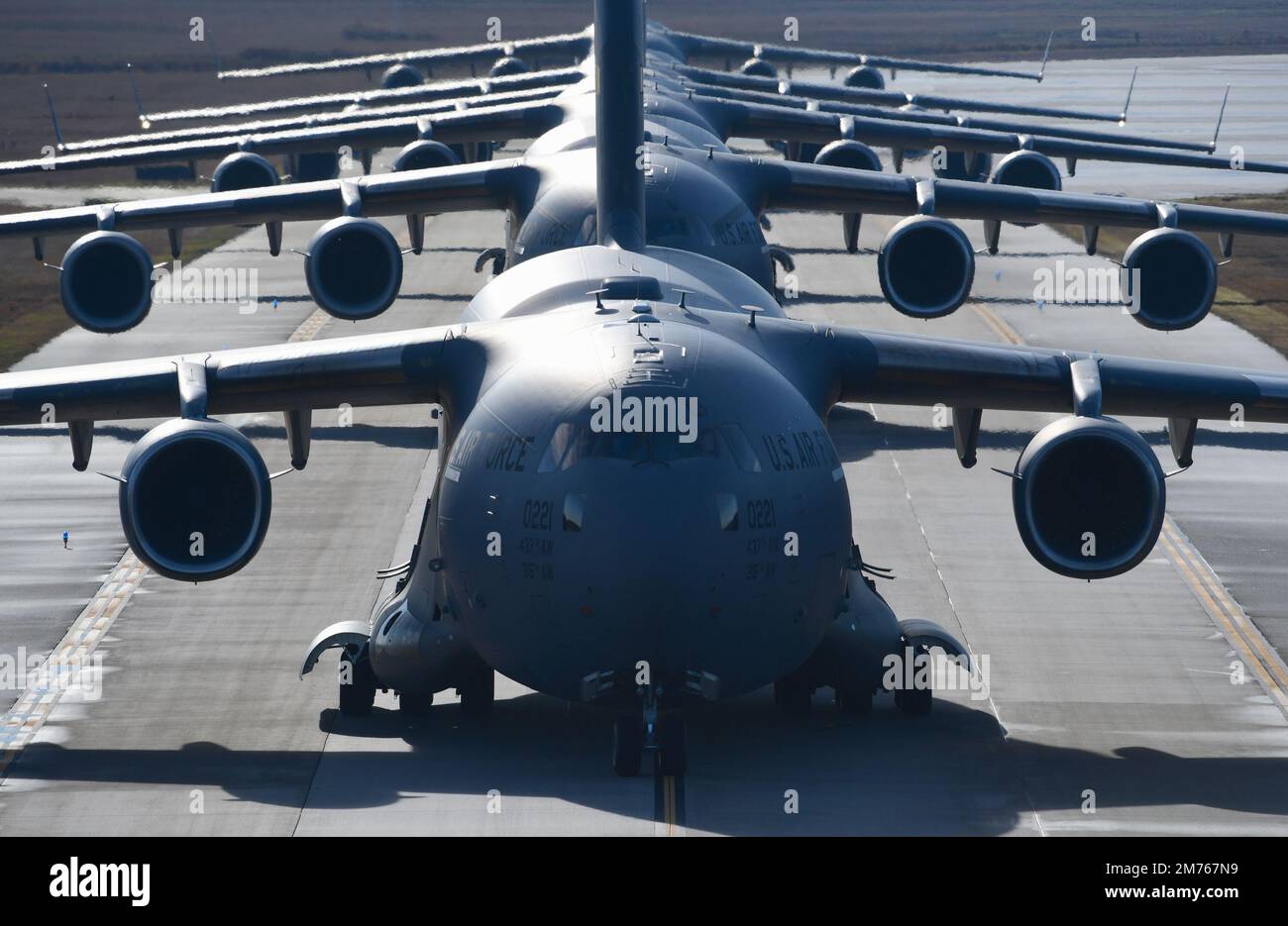 U.S. Air Force C-17 Globemaster III aircraft line up on the taxiway ...