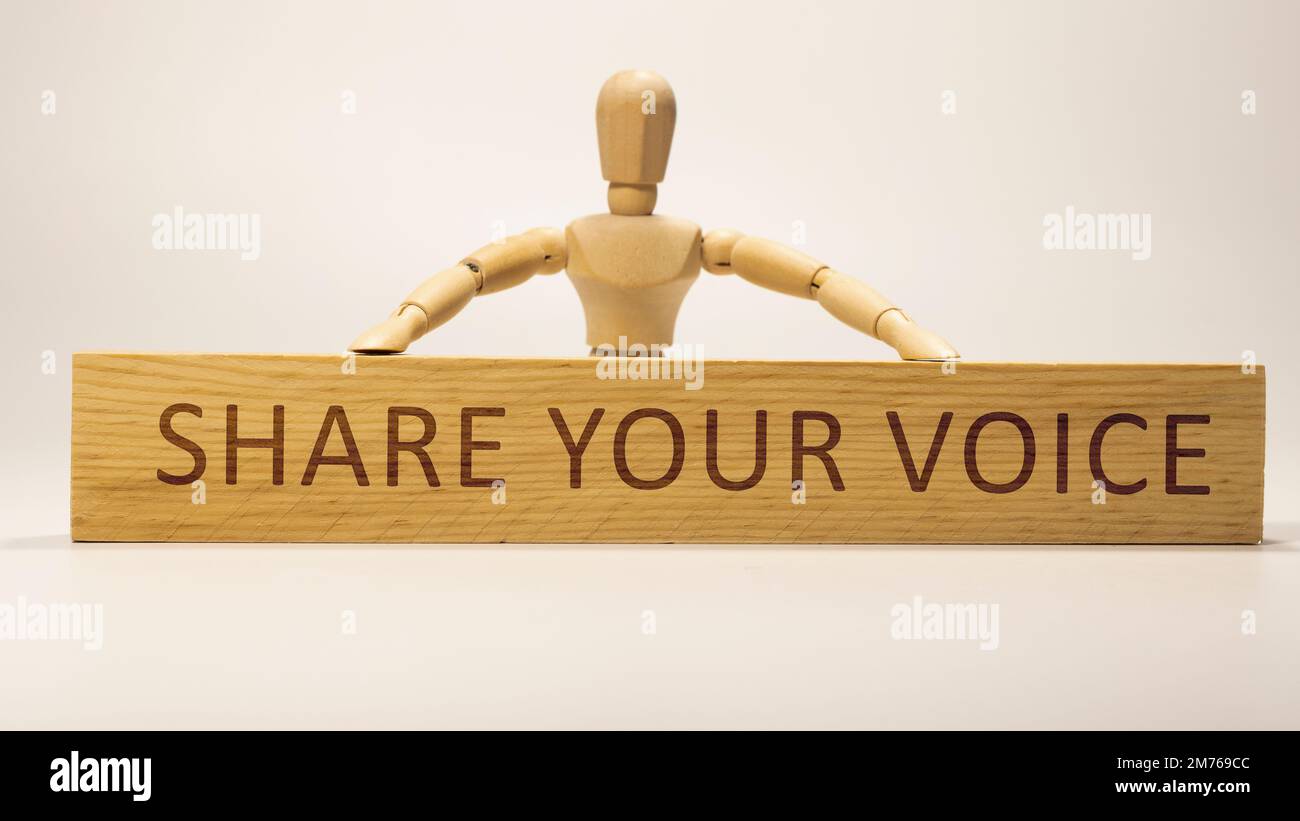 Share your voice writing on wooden surface. Wooden Concept Stock Photo ...
