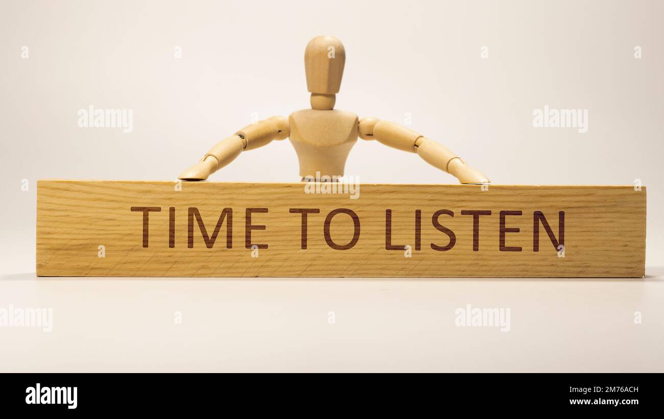 Time to listen was written on the wooden surface. Wooden Concept Stock ...