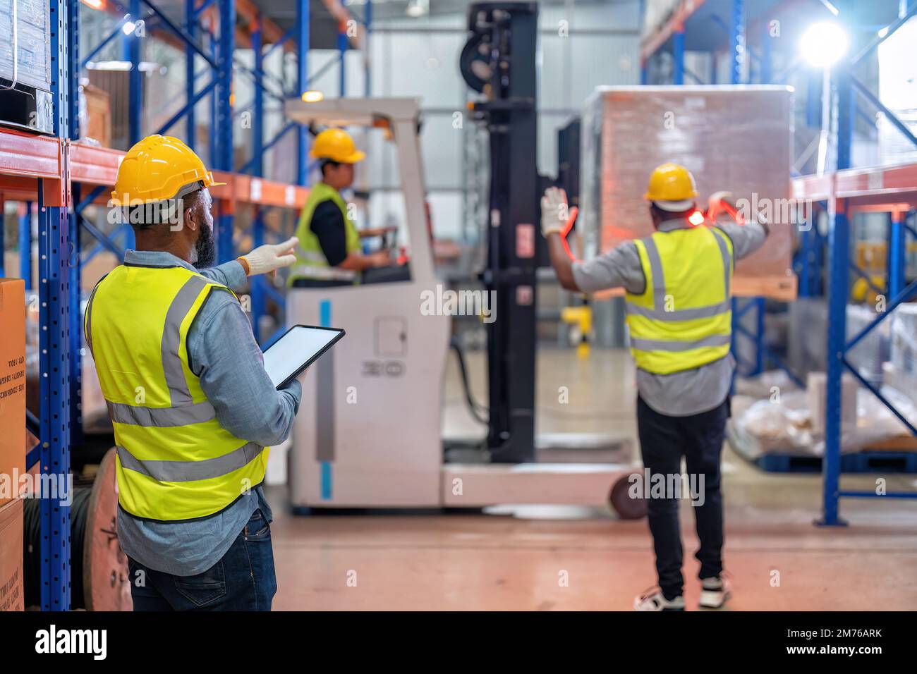 African american working in warehouse hold red light give signal to ...