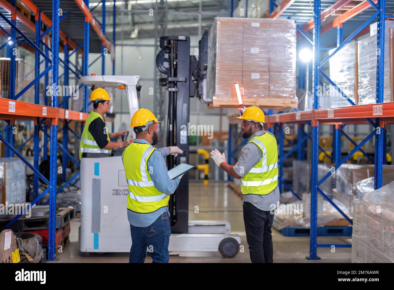 African american working in warehouse hold red light give signal to ...