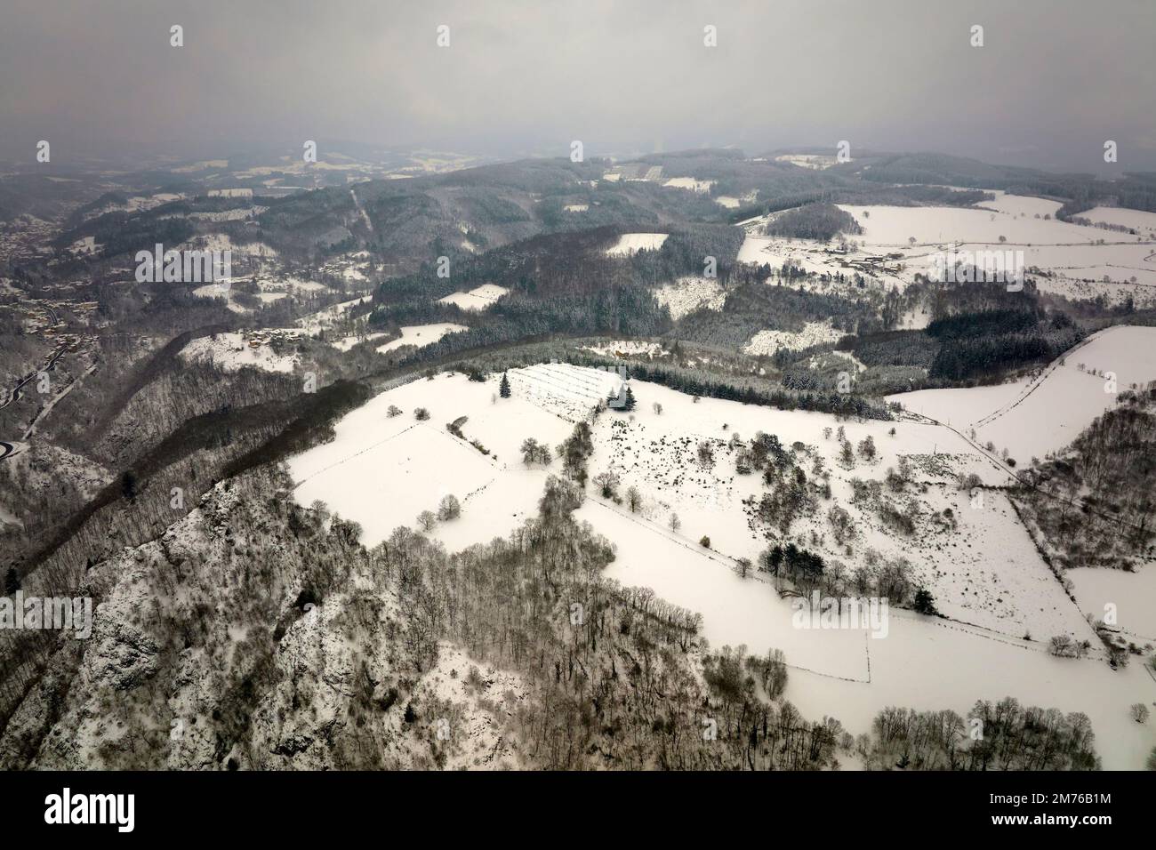 Aerial foggy landscape with mountain cliffs covered with fresh fallen ...