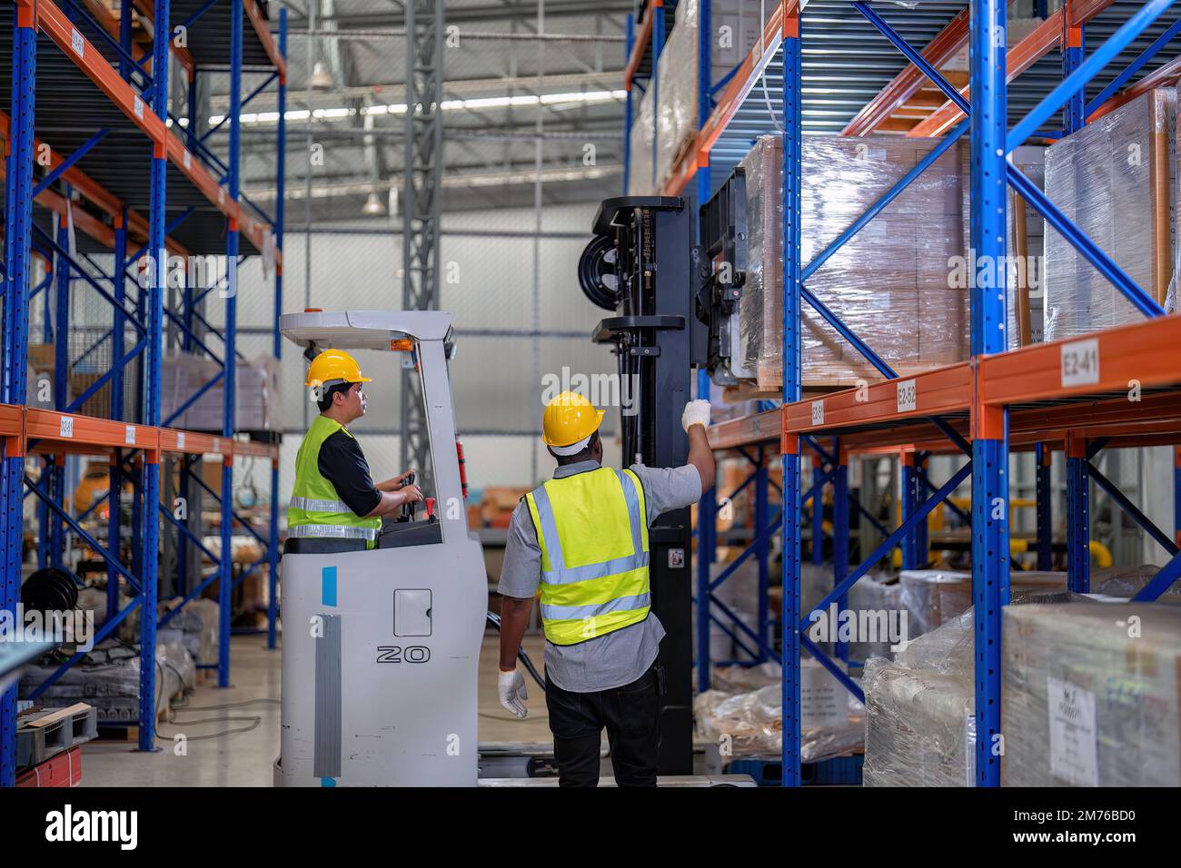 African american working in warehouse hold tablet stock check while ...
