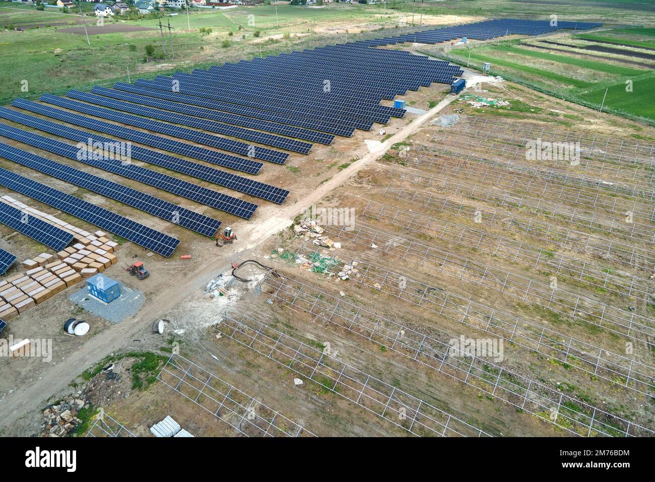 Aerial view of big electric power plant under construction with many ...