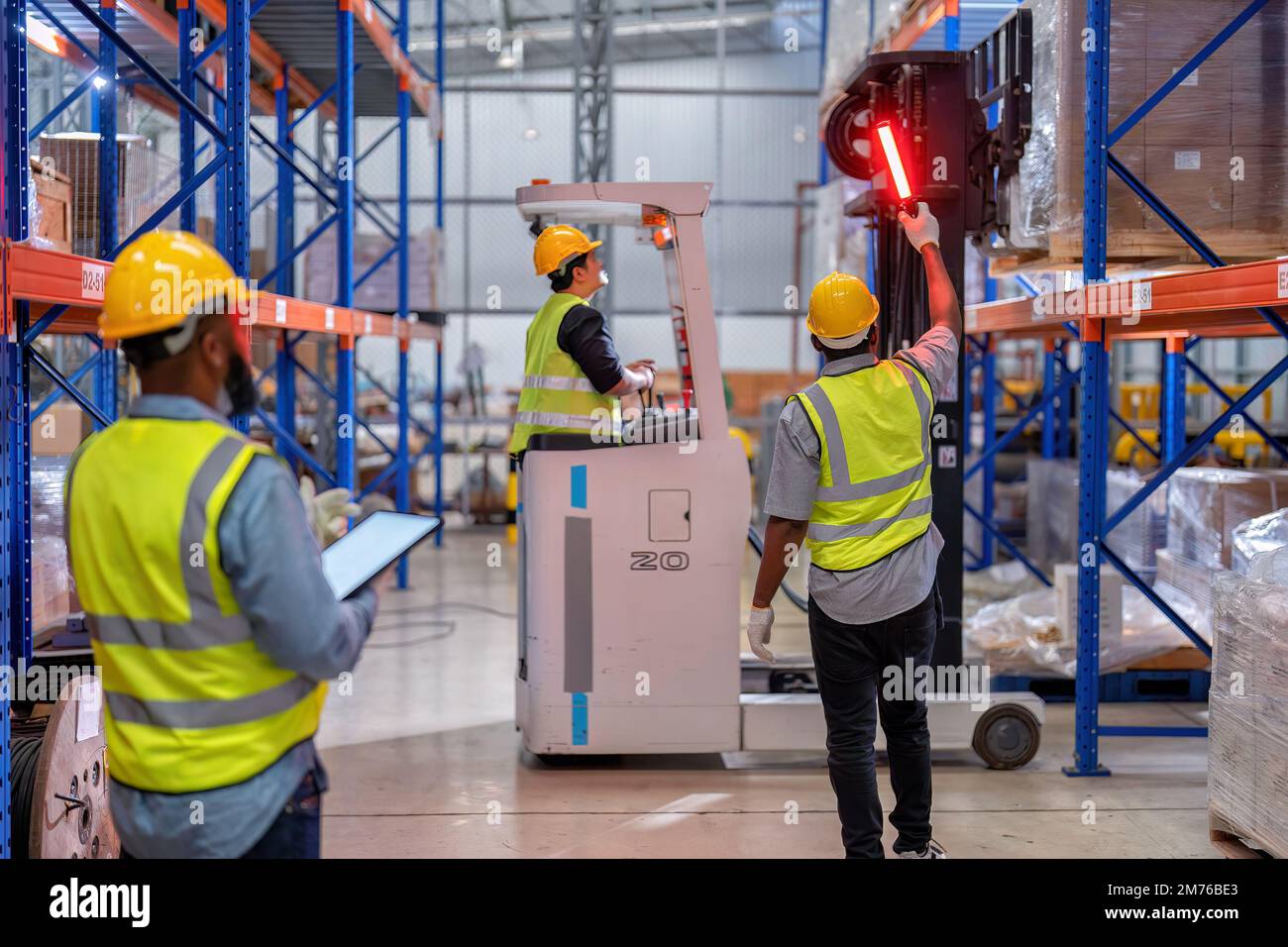 African american working in warehouse hold red light give signal to ...