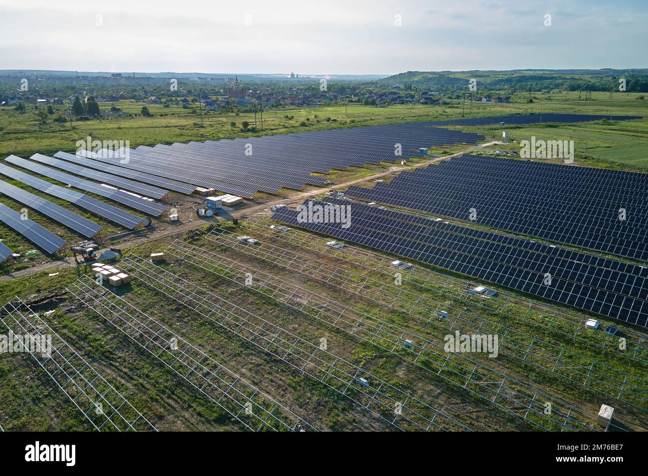 Aerial view of big electric power plant under construction with many ...
